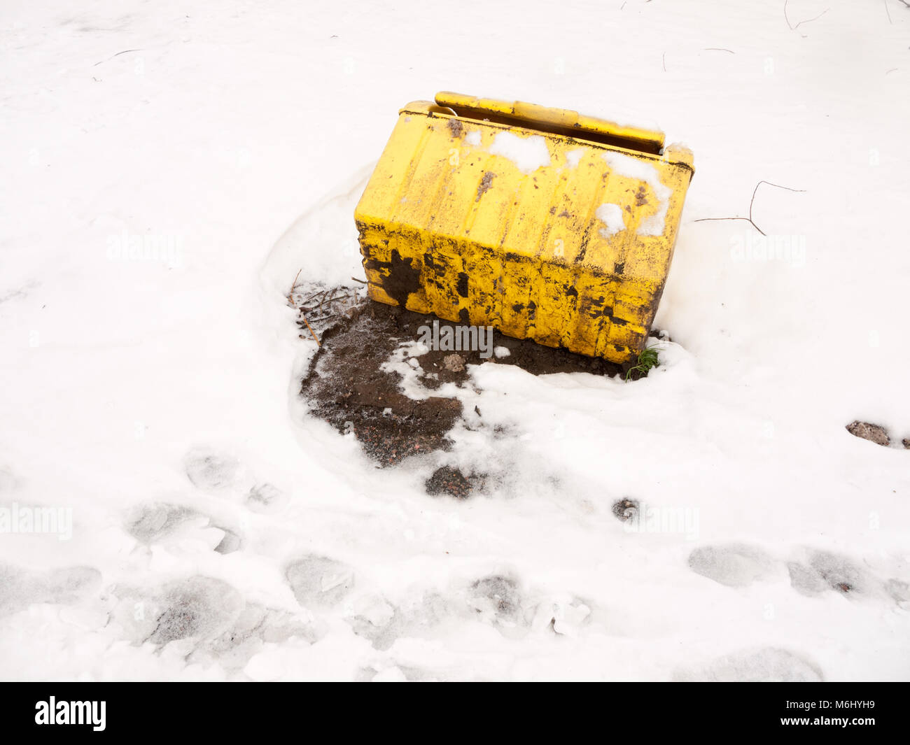 fallen turned over yellow grit box salt outside snow storm; essex ...
