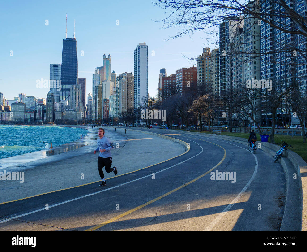 Runners and cyclists on Lakefront Trail. Chicago, Illinois Stock Photo ...