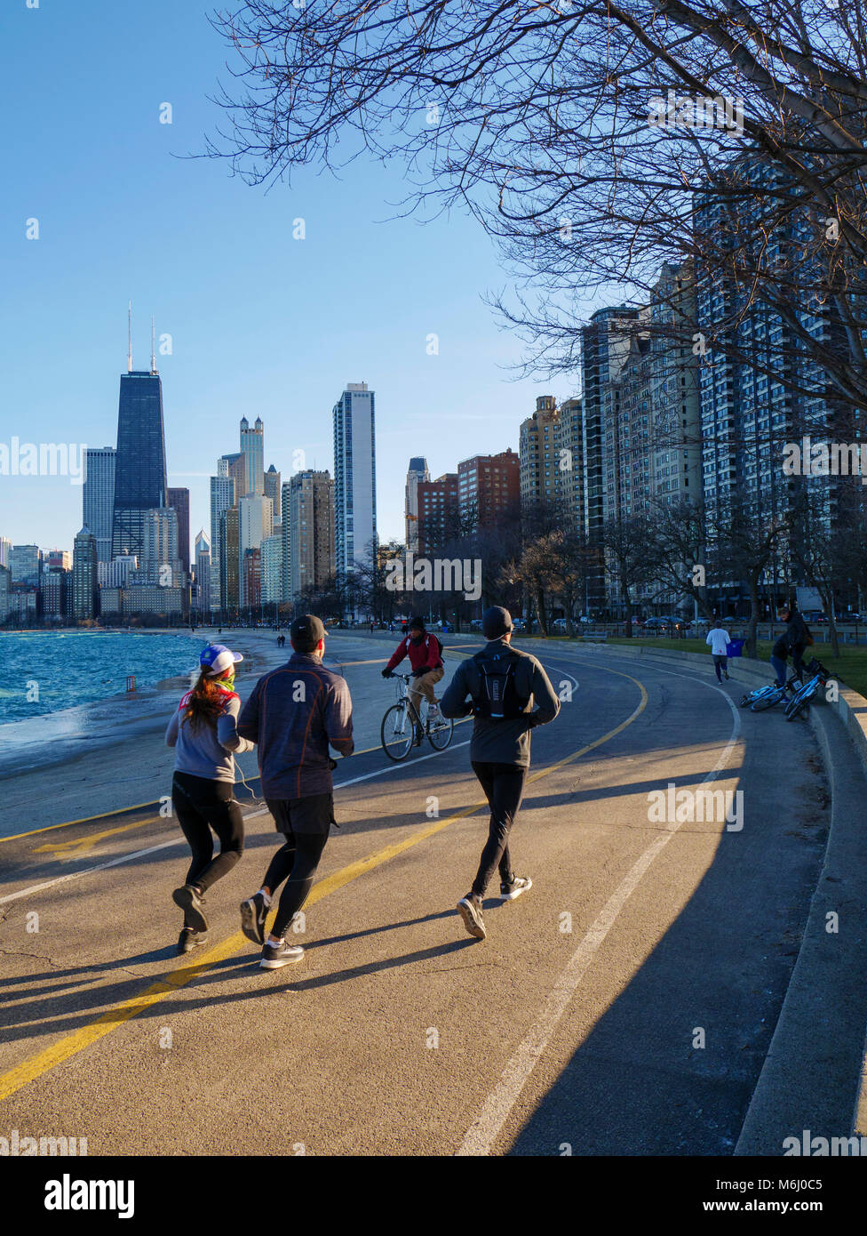 Runners and cyclists on Lakefront Trail. Chicago, Illinois Stock Photo ...