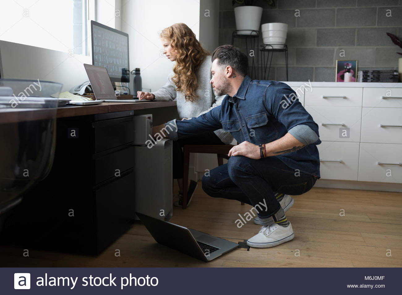 Designers working in office Stock Photo - Alamy
