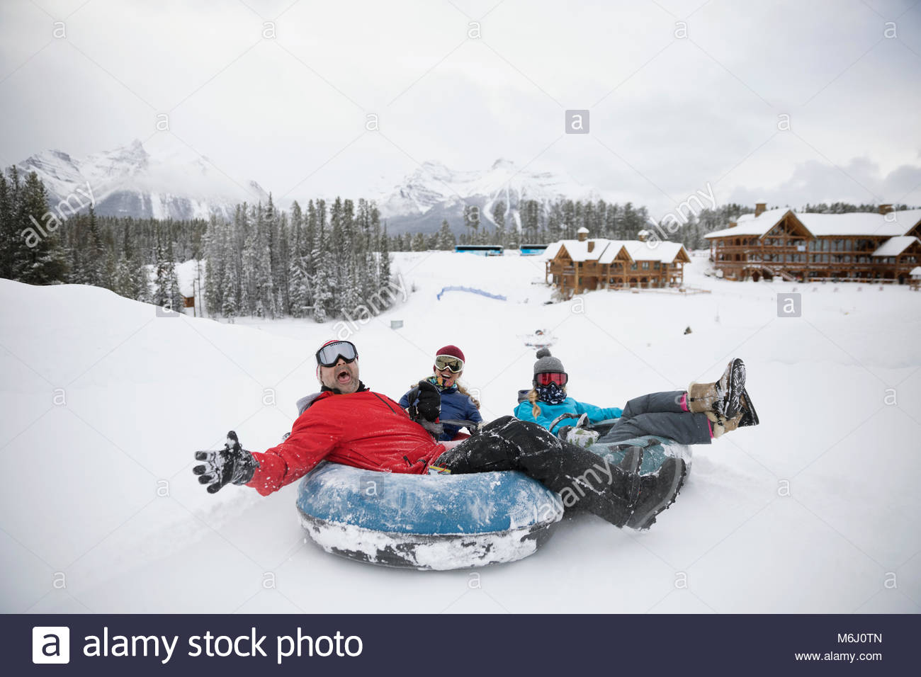 Portrait of mother and daughter in ski wear at ski resort hi-res stock ...