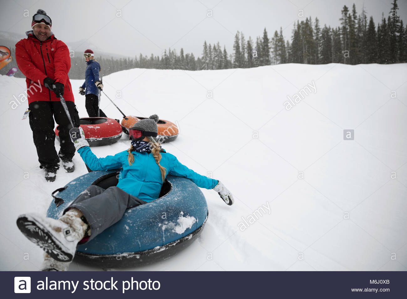 Women snow tubing hi-res stock photography and images - Alamy