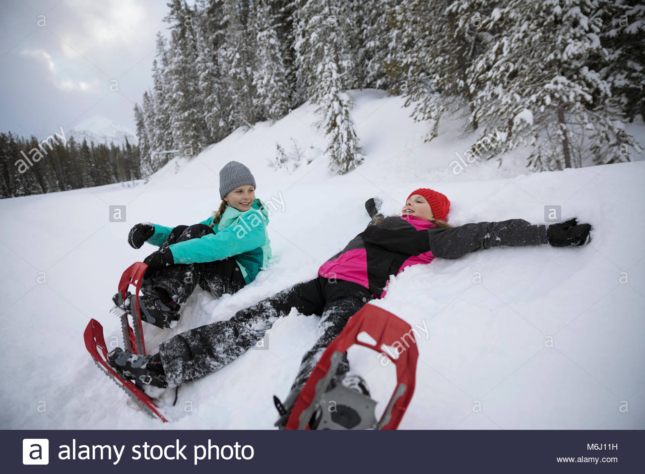 Girl making snow angels hi-res stock photography and images - Alamy
