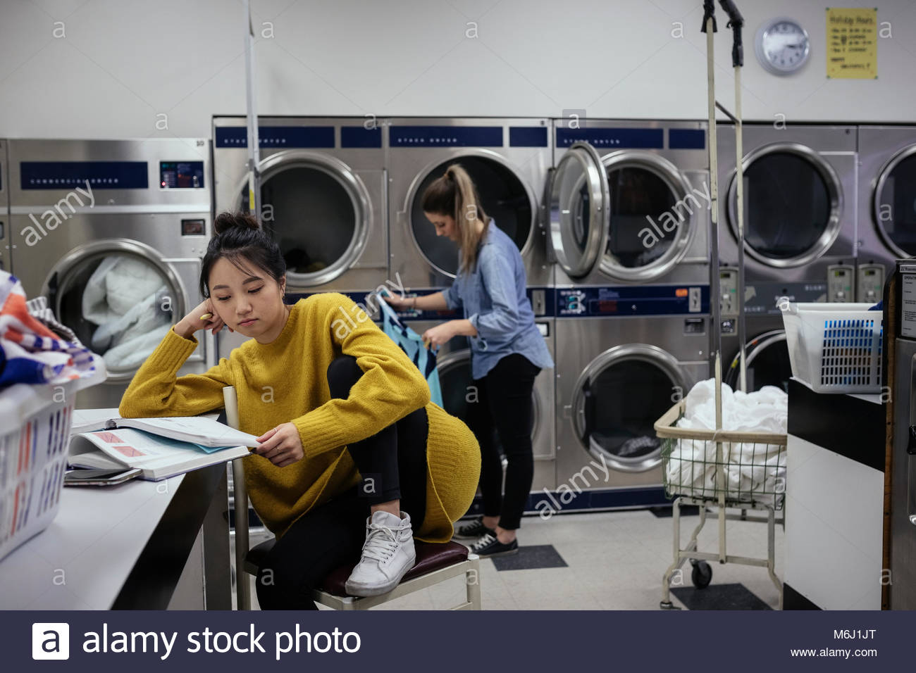 Two female studying weekend activities hi-res stock photography and ...