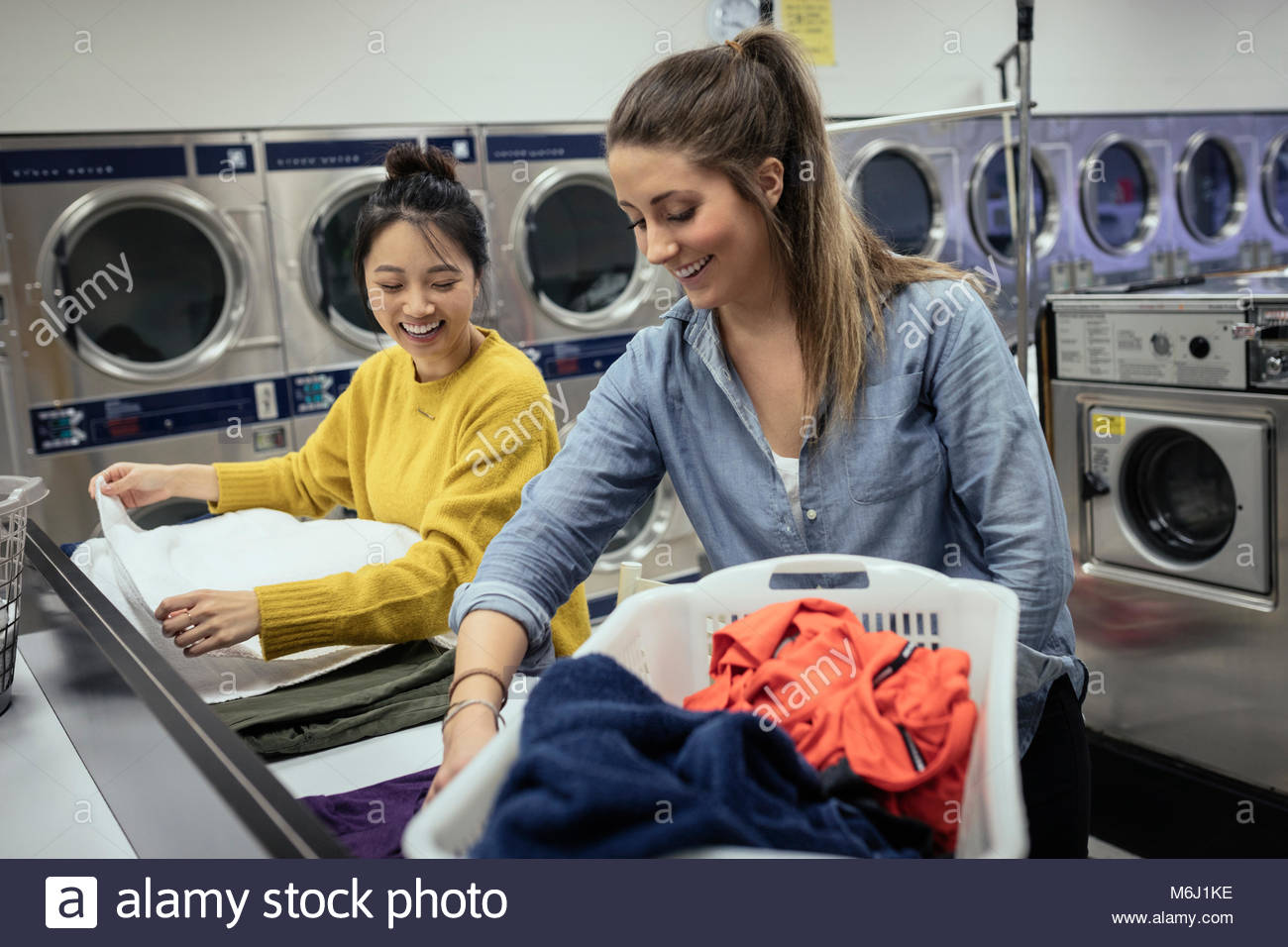 Two women doing washing hi-res stock photography and images - Alamy