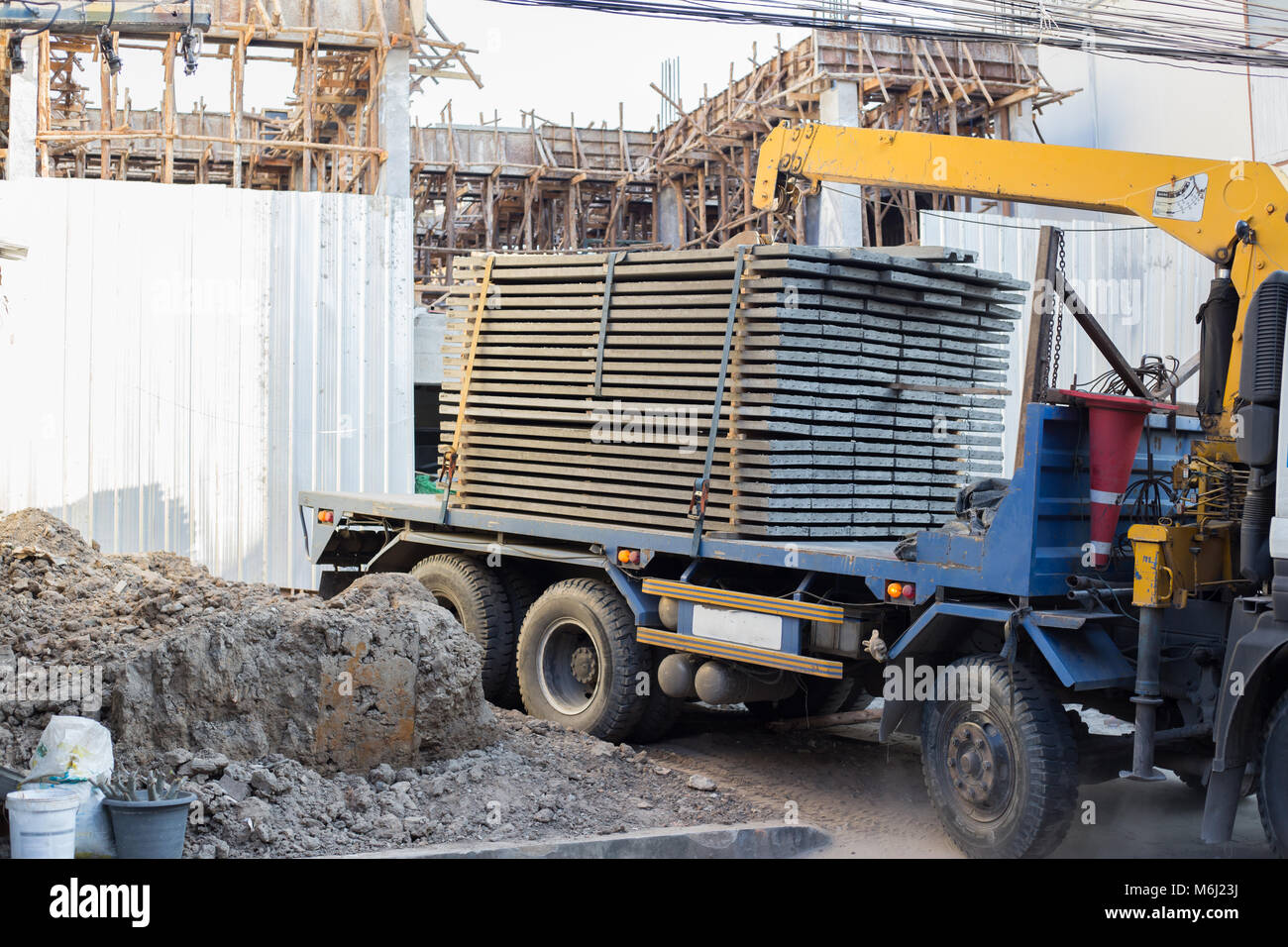 Precast plank concrete slabs on trucks at site construction Stock Photo ...