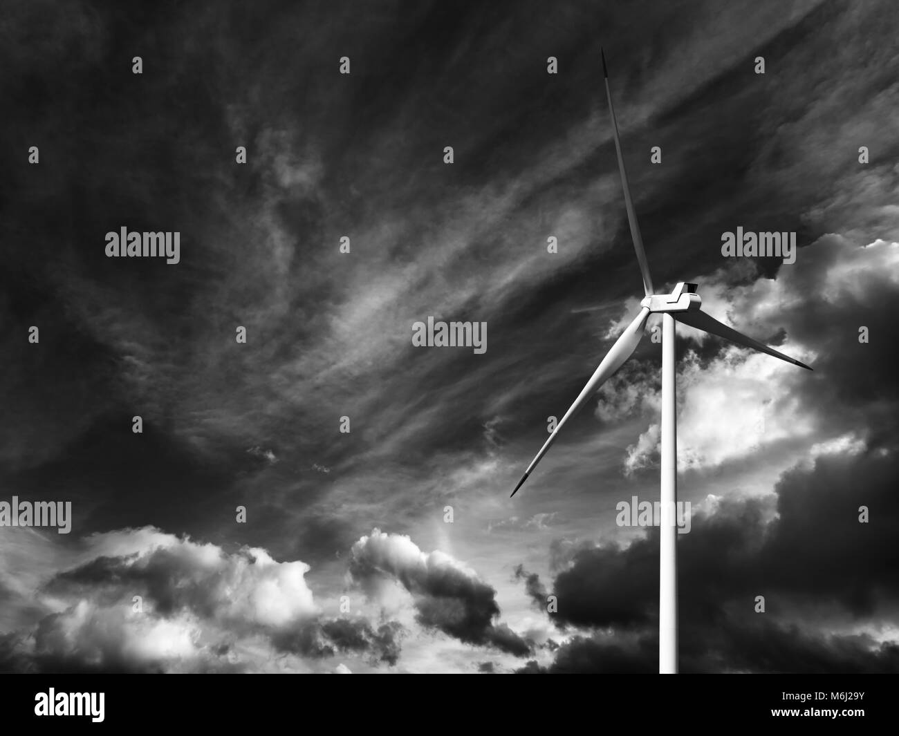 Wind turbine and black and white sky with storm clouds at windy day ...