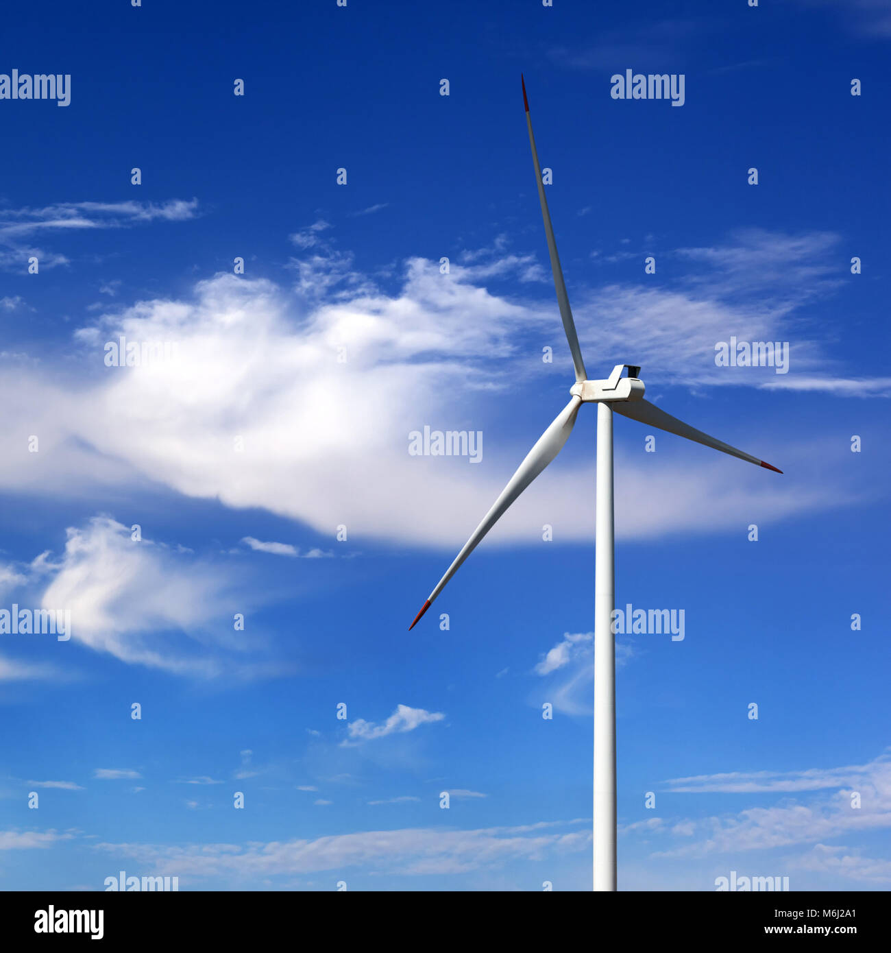 Wind turbine and blue sky with clouds at sun windy day Stock Photo - Alamy