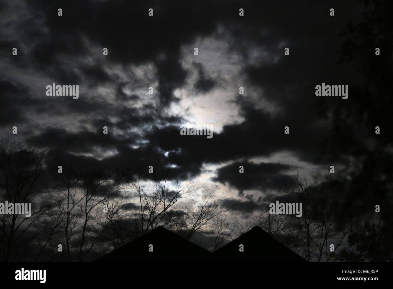 Cloudy moonlit night sky hi-res stock photography and images - Alamy