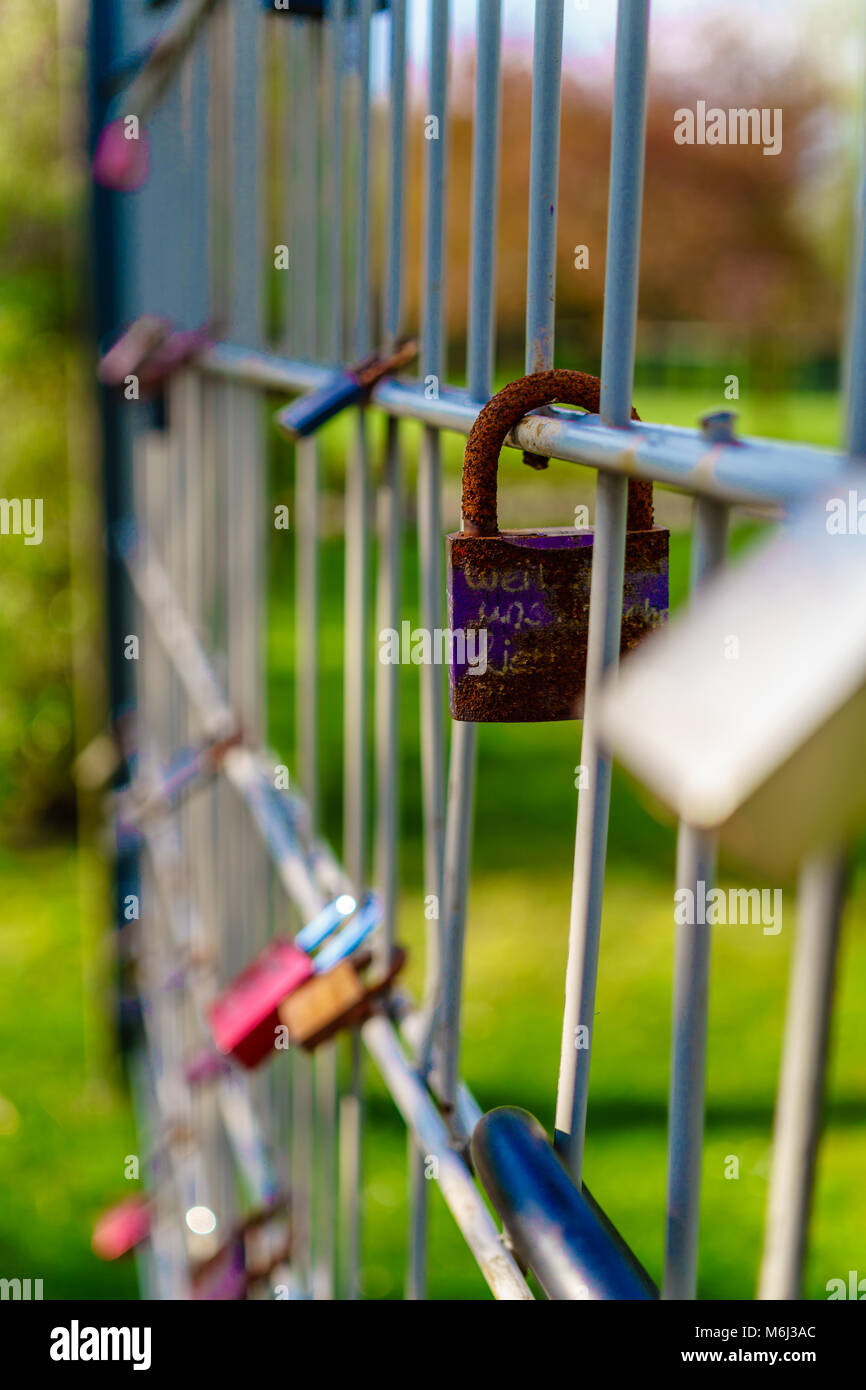 Love locks on a fence representing secure friendship and romance Stock ...
