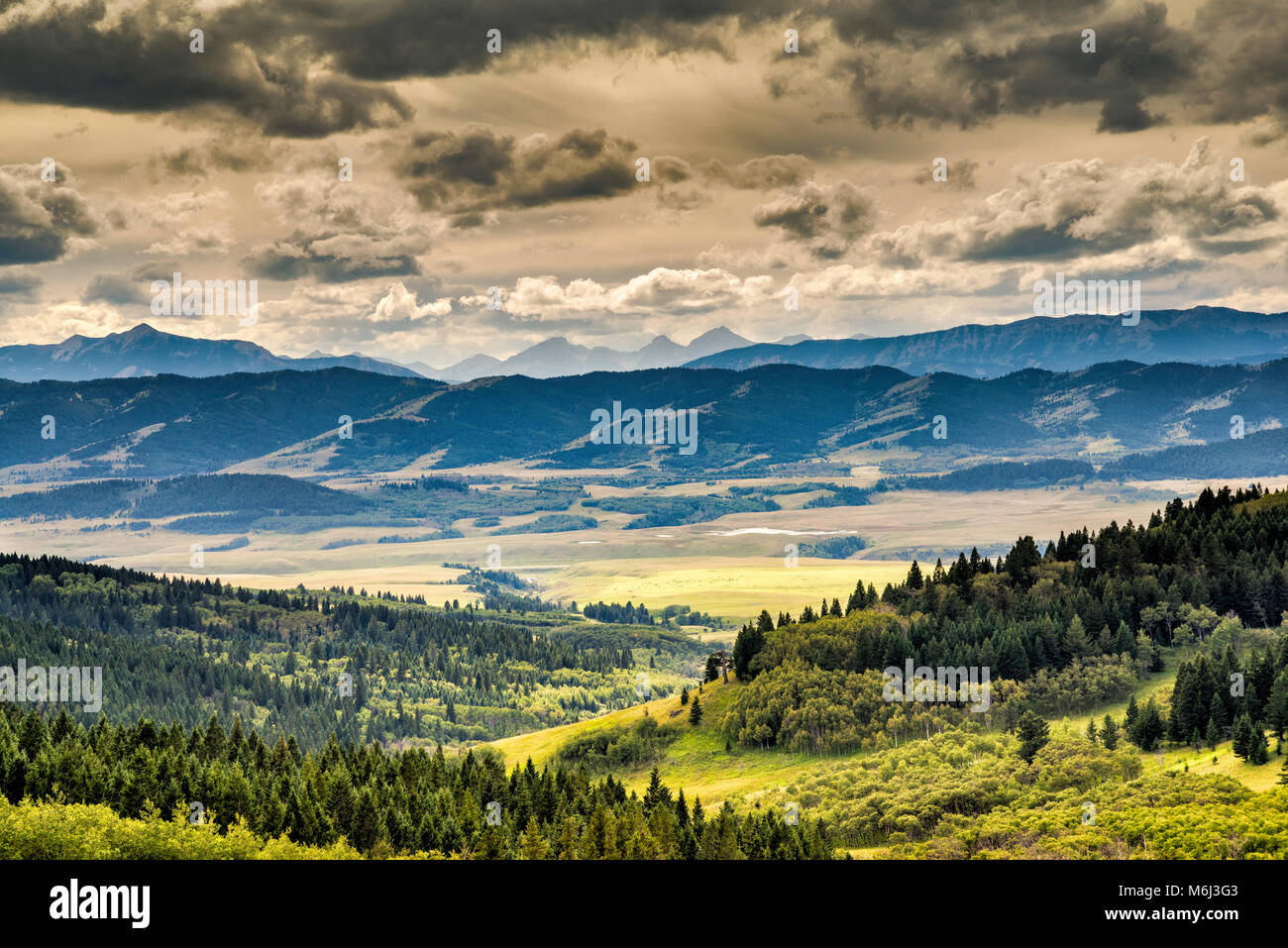 Dramatic clouds over Canadian Rockies, Main Ranges in far distance ...