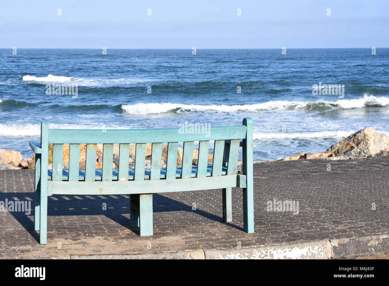 A colorful blue bench near the beach of Swakopmund Namibia Southern ...