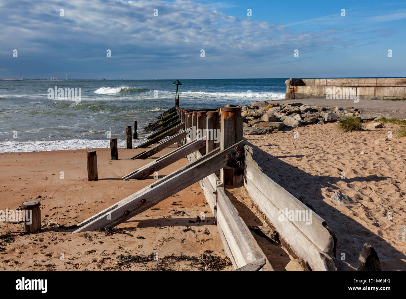 Strong wooden groynes erected at Seaton Sluice to protect the habour ...