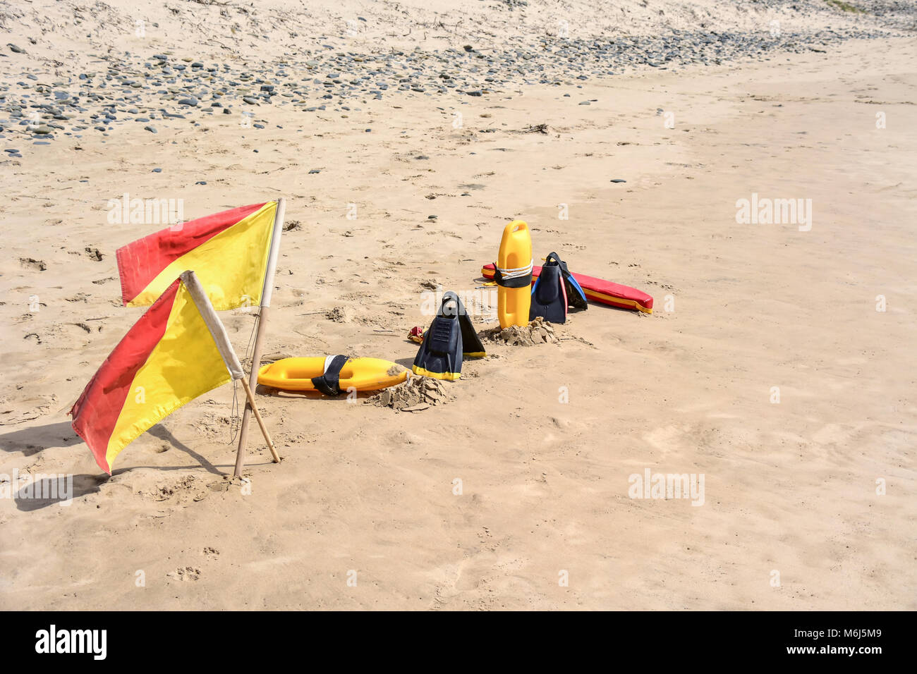 Lifeguard equipment in yellow and red colors on the beach in Coffee Bay ...