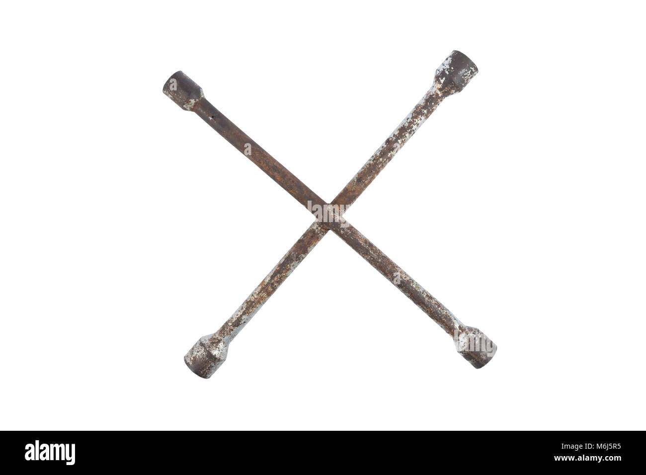 Old and used x-type socket wrench isolated on white background ...