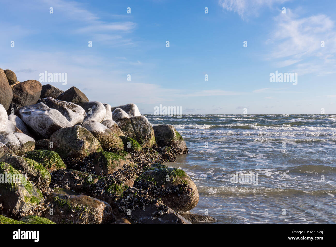 Ice-covered rocks; groyne on Saeby Beach, Denmark Stock Photo - Alamy