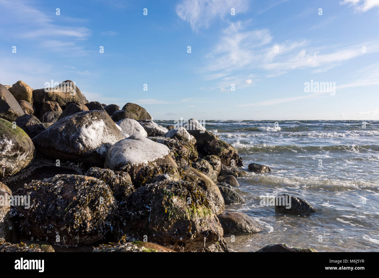 Ice-covered rocks; groyne on Saeby Beach, Denmark Stock Photo - Alamy