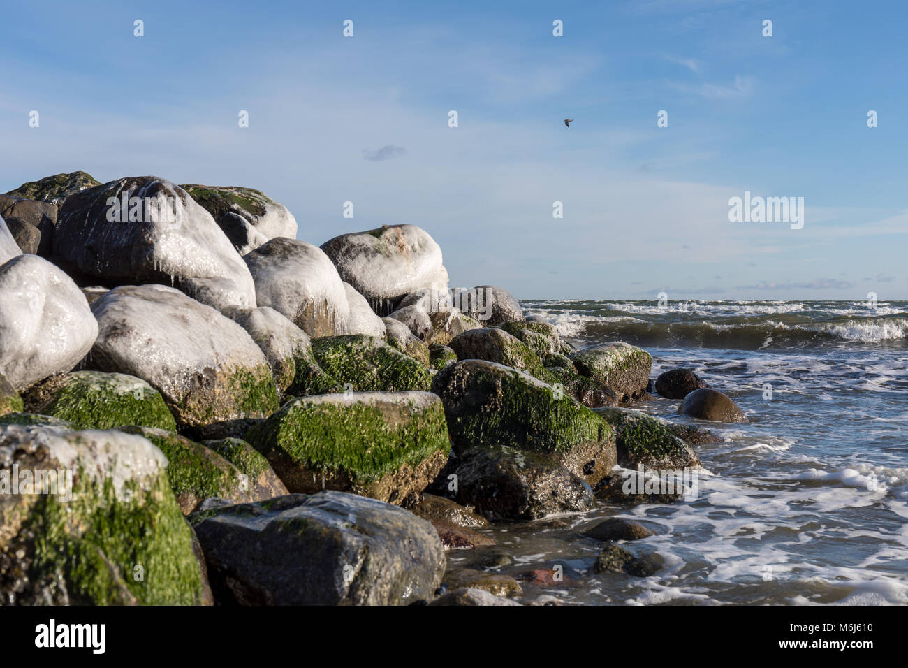 Ice-covered rocks; groyne on Saeby Beach, Denmark Stock Photo - Alamy