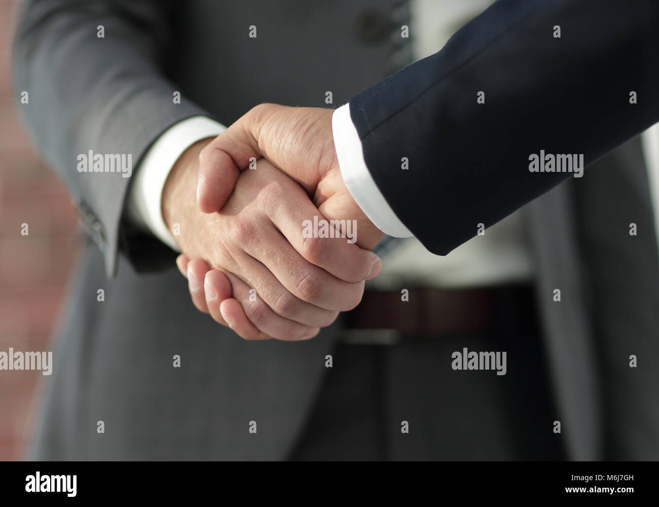 Business men giving a handshake. Business concept Stock Photo - Alamy