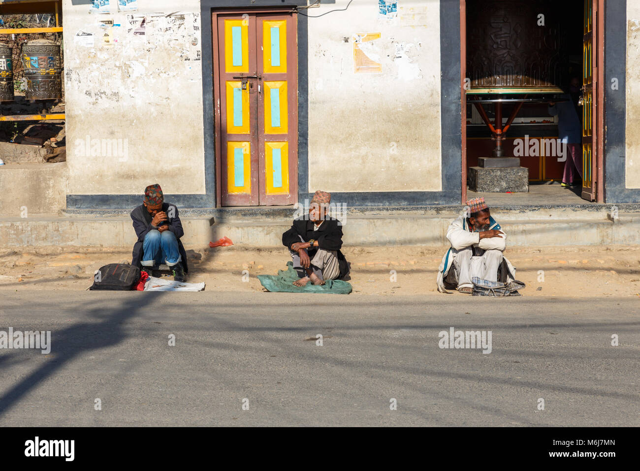 Three men sit hi-res stock photography and images - Alamy