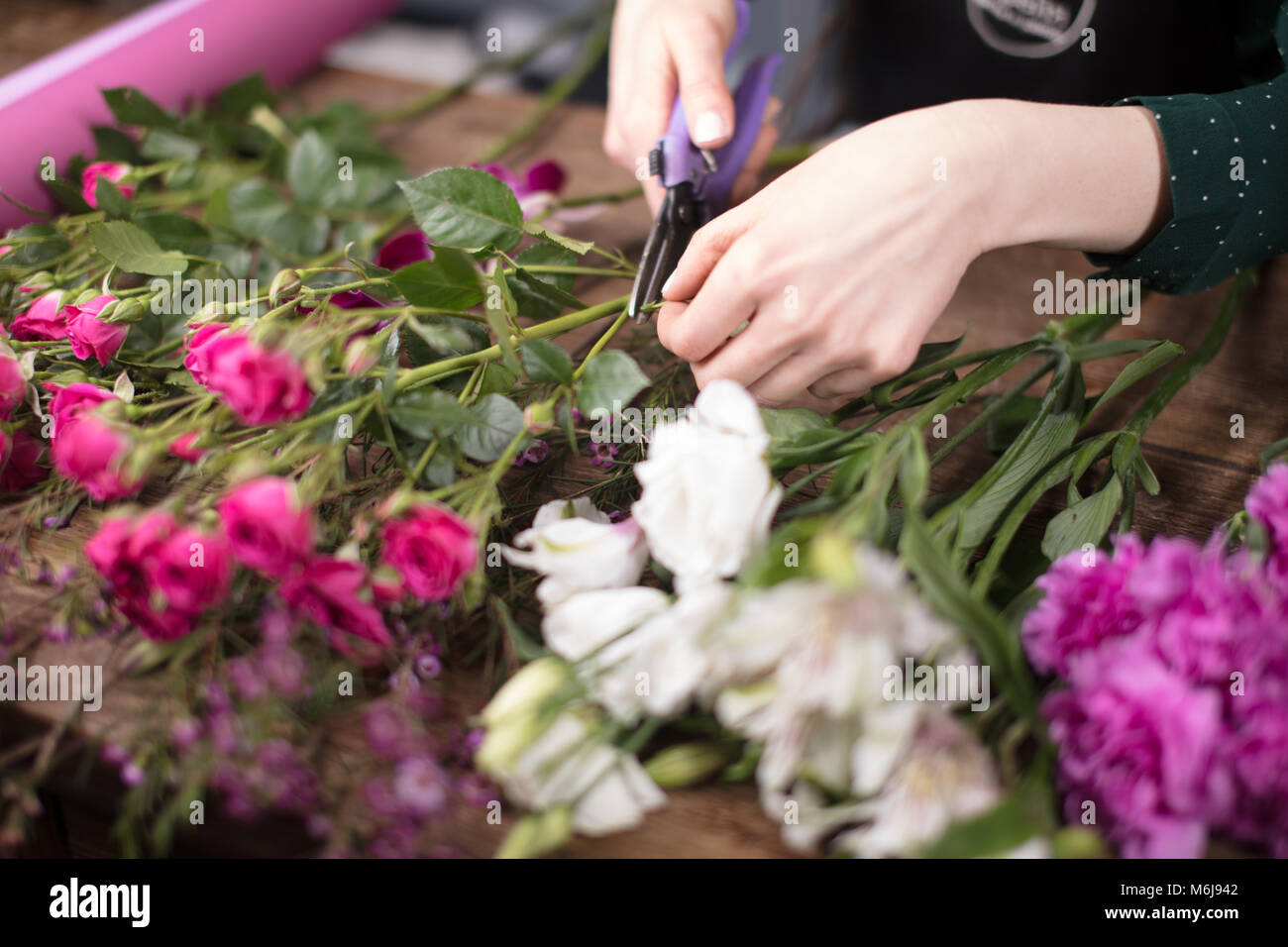 Florist leading small business, cutting flowers in shop Stock Photo - Alamy