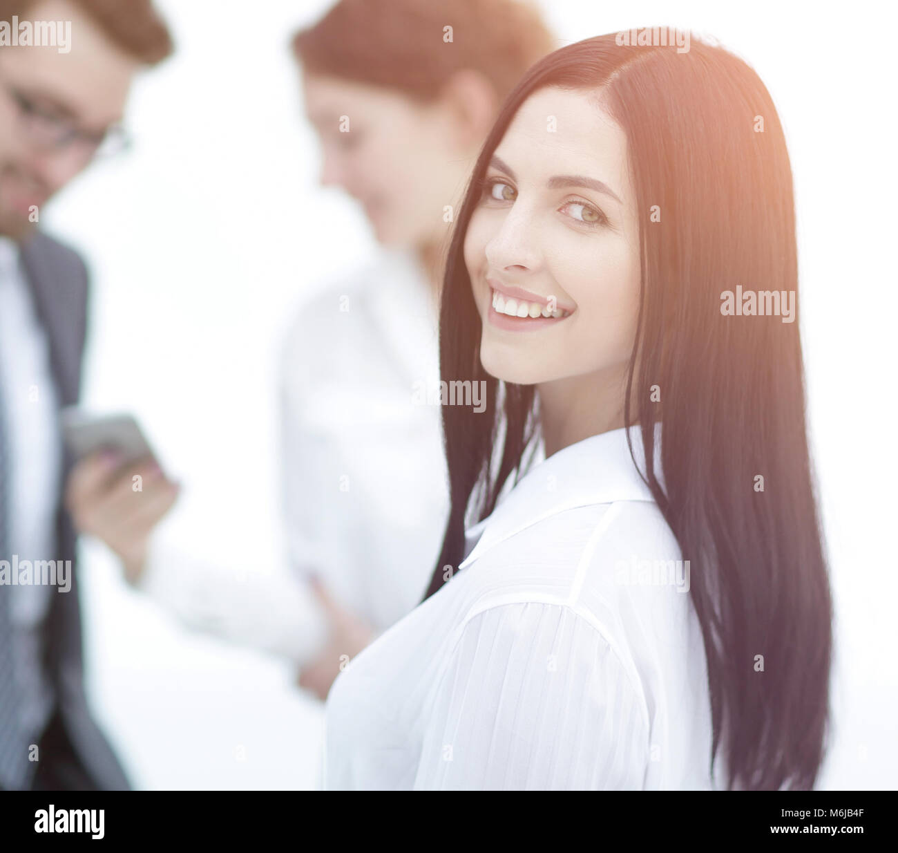 close-up of a beautiful woman manager and co-workers in the office ...