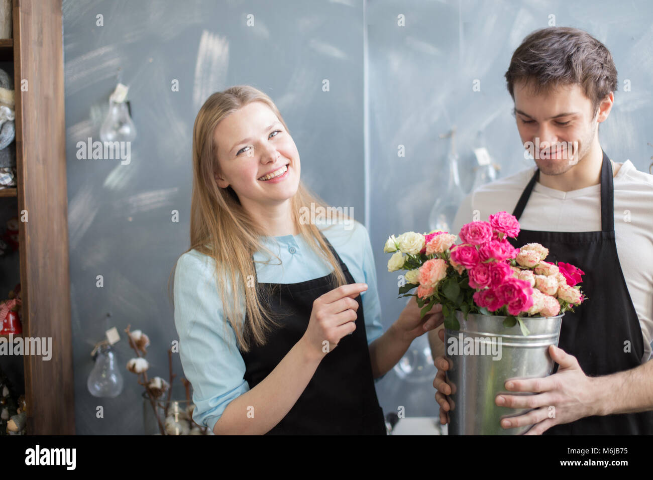 girl pointing to basket with flowers Stock Photo - Alamy