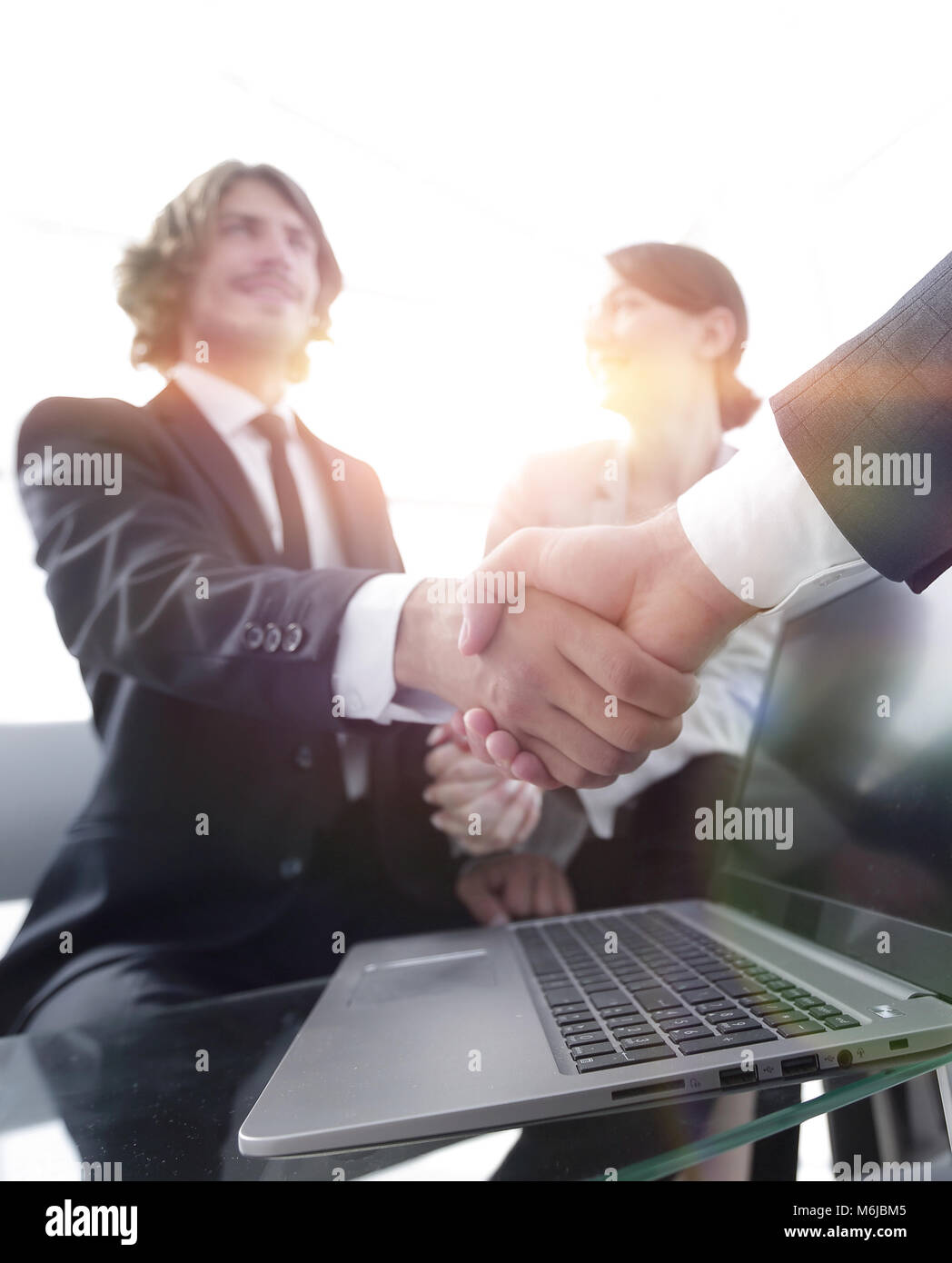 Two confidence businessman shaking hands close-up Stock Photo - Alamy