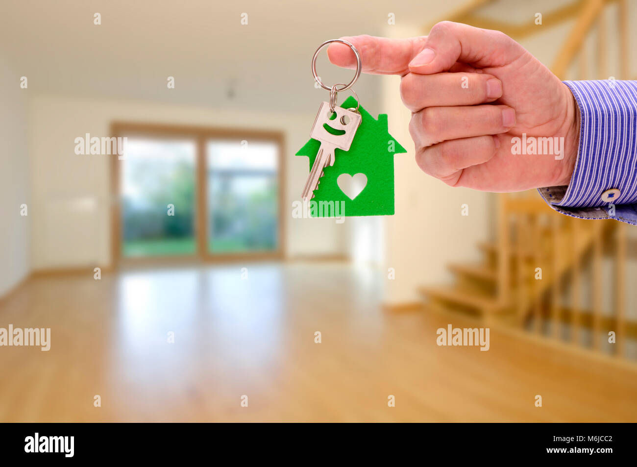 key for your new home in hand of real estate agent Stock Photo - Alamy