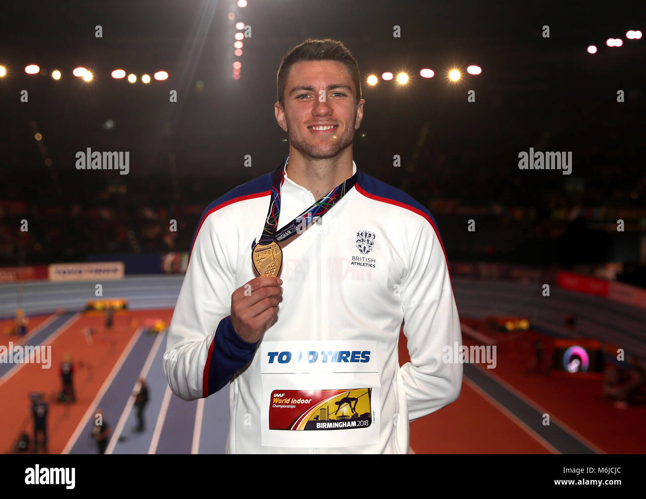 Great Britain's Andrew Pozzi poses with his gold medal after winning ...