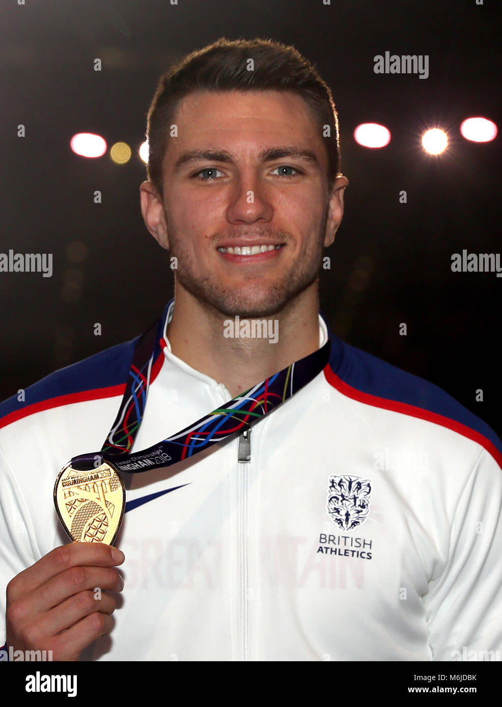 Great Britain's Andrew Pozzi poses with his gold medal after winning ...