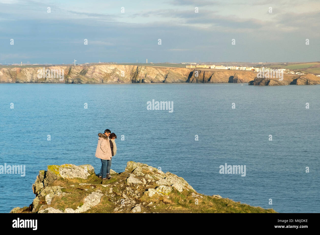 People standing on Towan Head looking across Newquay Bay towards Porth ...