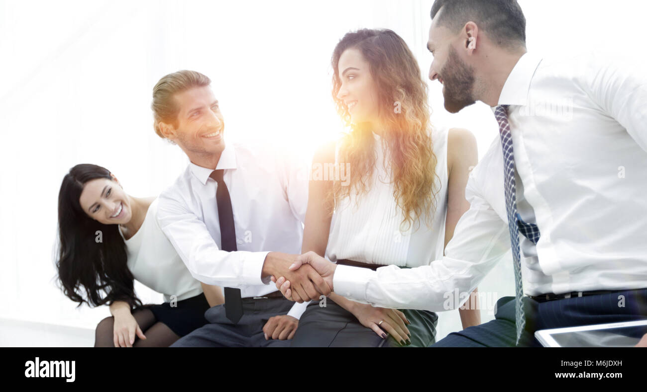 welcome handshake between two colleagues Stock Photo - Alamy