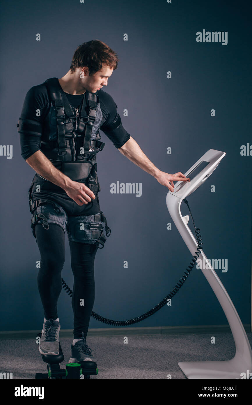 man training on stepper with electric muscle stimulation Stock Photo ...
