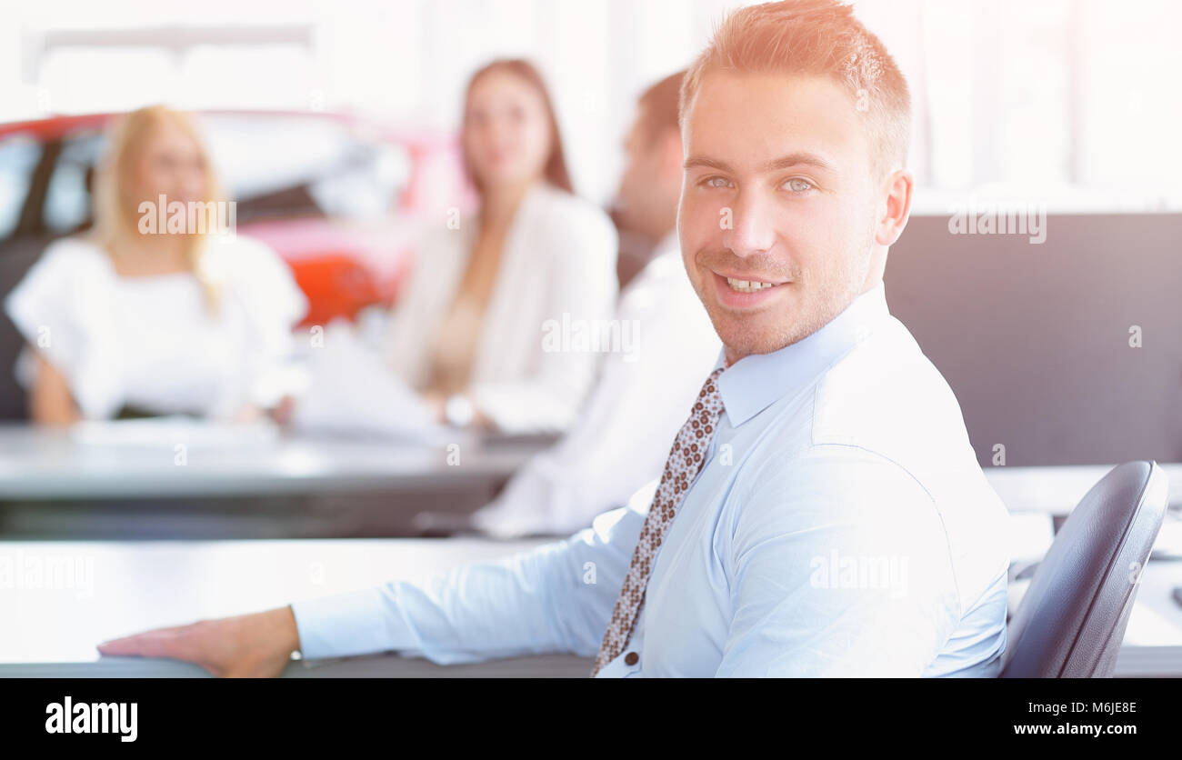 portrait of confident businessman sitting at the Desk Stock Photo - Alamy