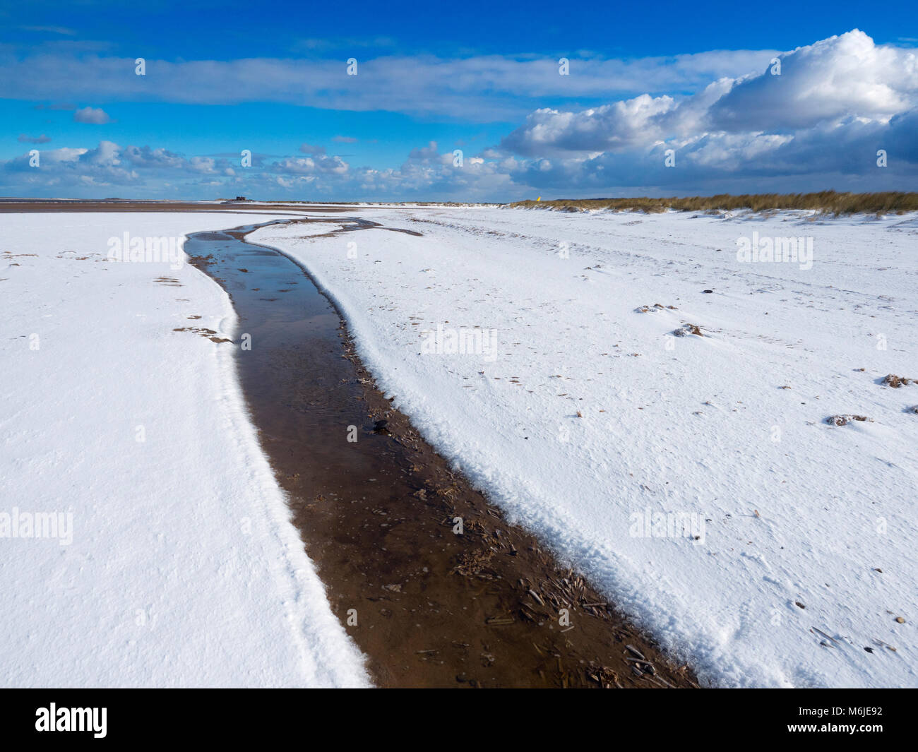 Beach at Titchwell RSPB Nature Reserve Norfolk under snow Stock Photo ...