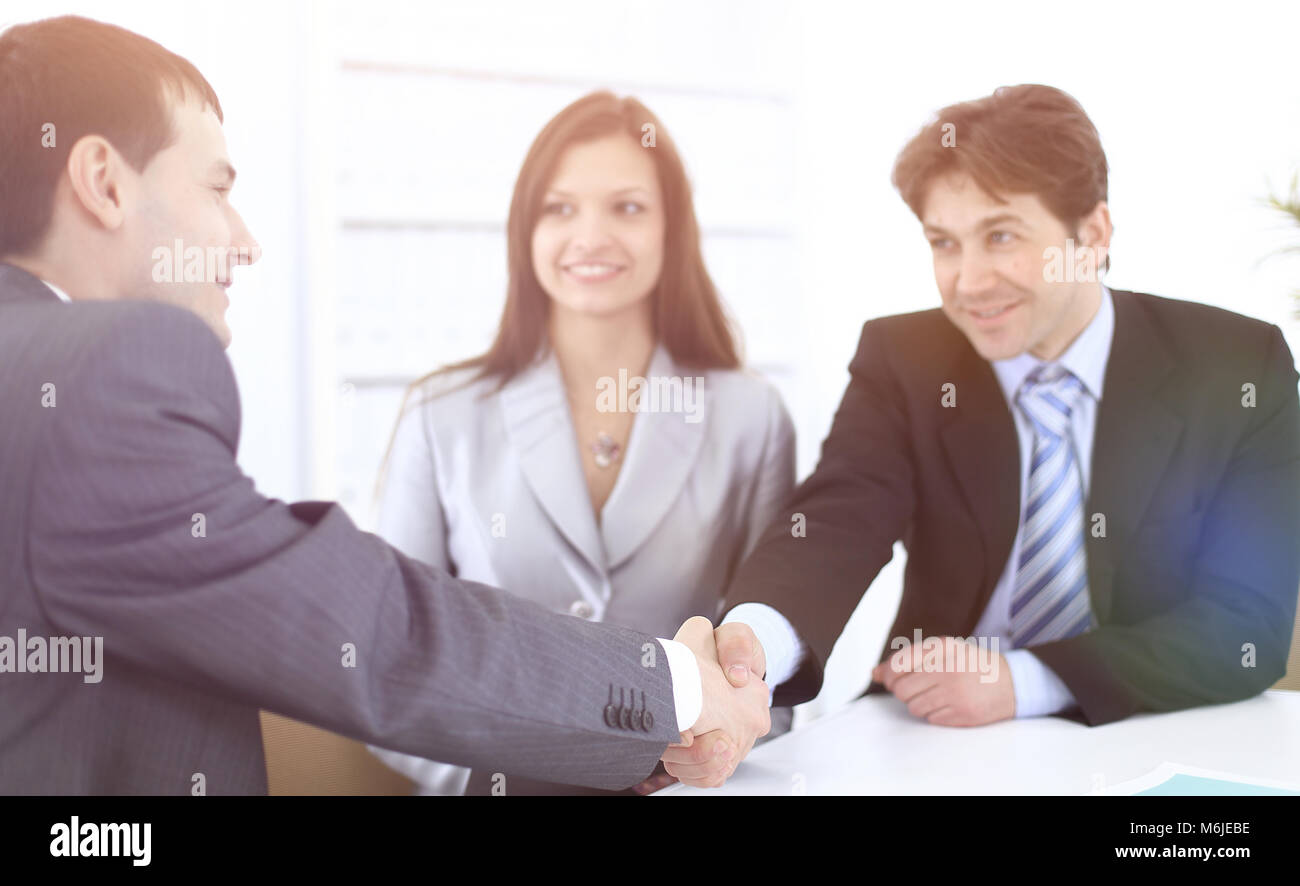 handshake business partners in the workplace Stock Photo - Alamy