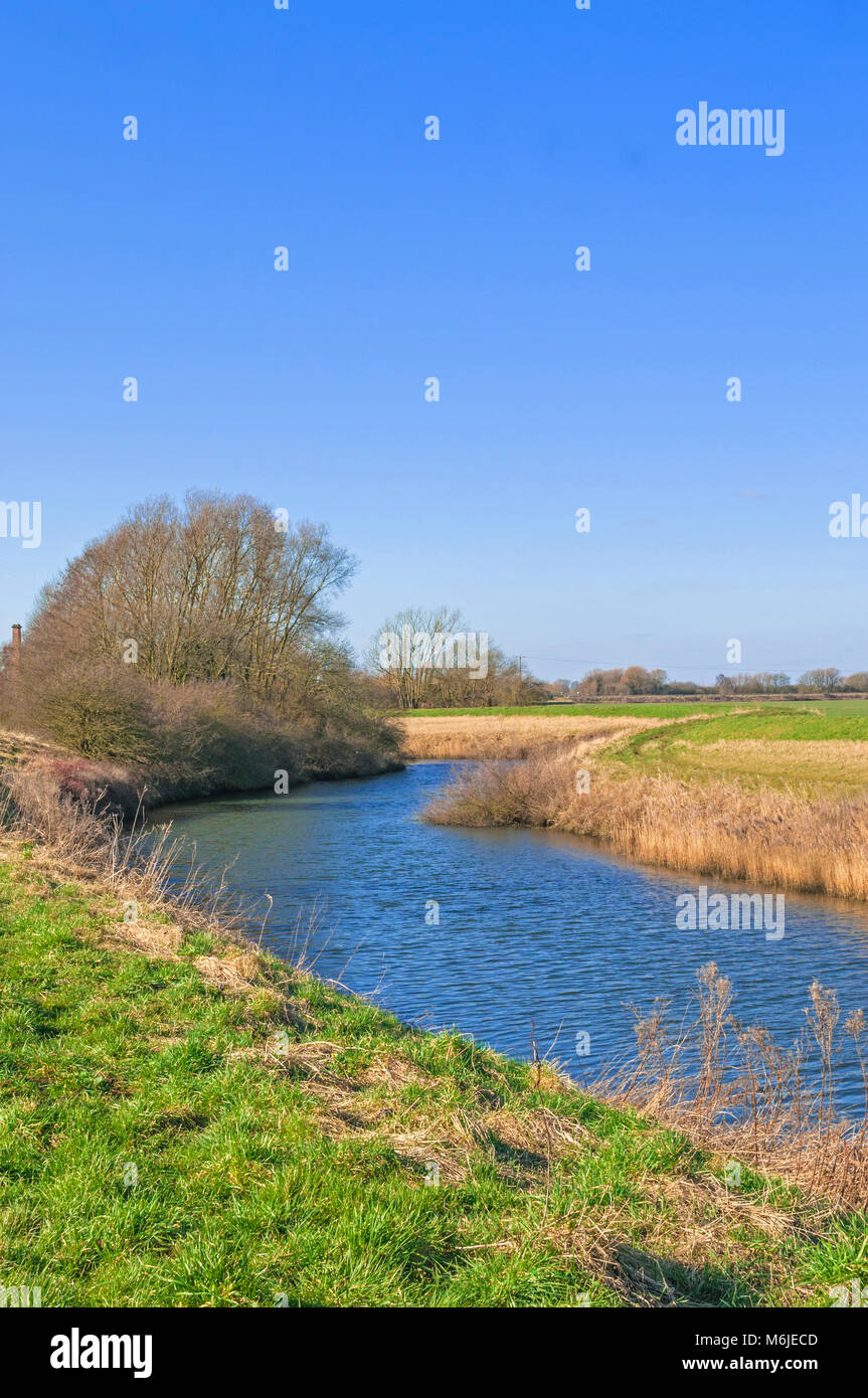 Steep banked river in winter, river Idle West Stockwith Nottinghamshire ...