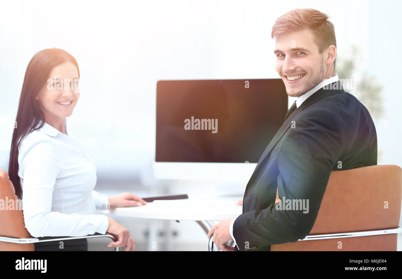Boss sitting behind desk employee hi-res stock photography and images ...