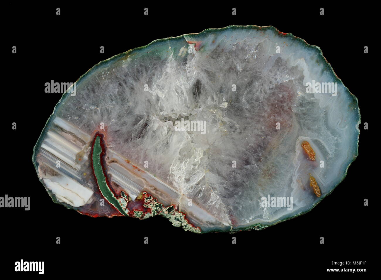 A cross-section of agate. Horizontal agate with quartz-agate fill (in ...