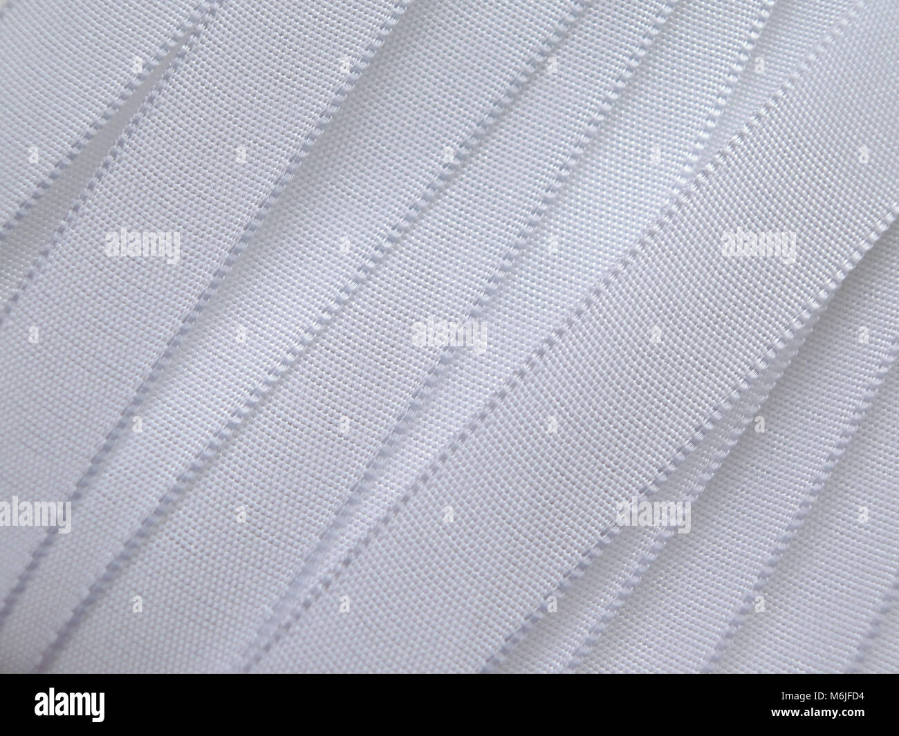 Shiny white satin ribbon background Stock Photo - Alamy