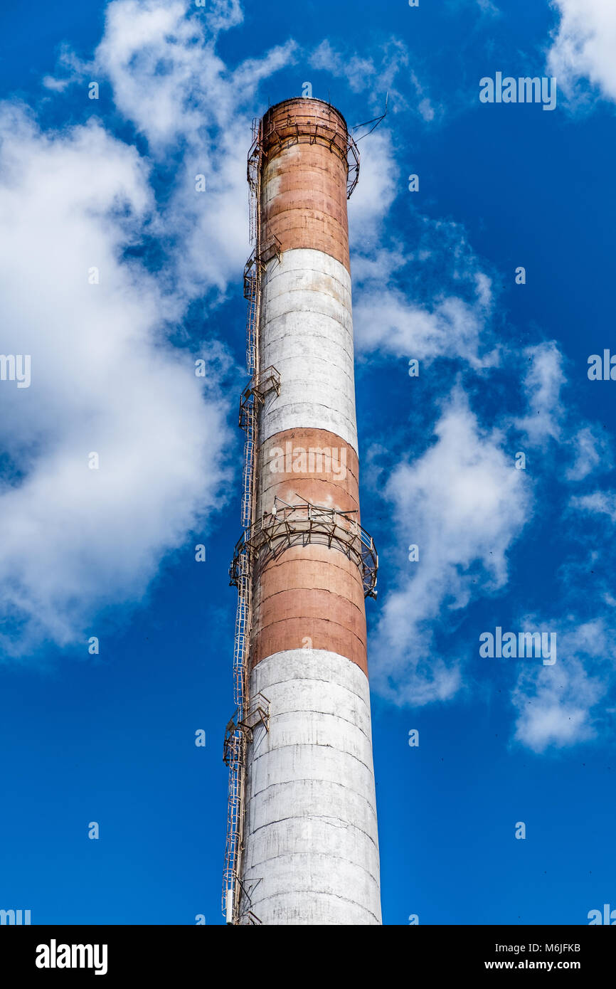 Brick chimney of a factory boiler room. Brick chimney with red and ...