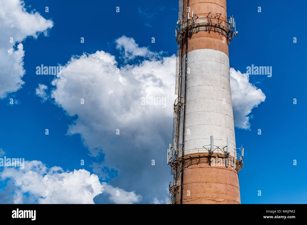 Brick chimney of a factory boiler room. Brick chimney with red and ...