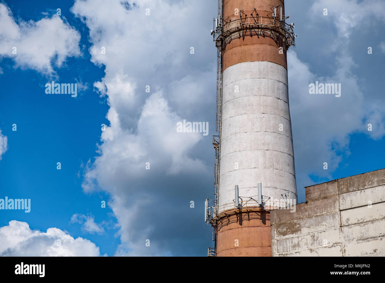 Brick chimney of a factory boiler room. Brick chimney with red and ...