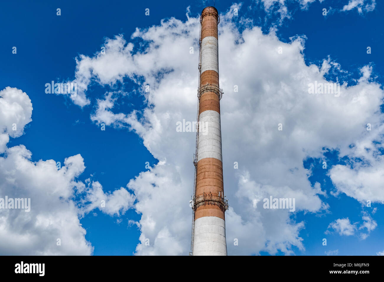 Brick chimney of a factory boiler room. Brick chimney with red and ...