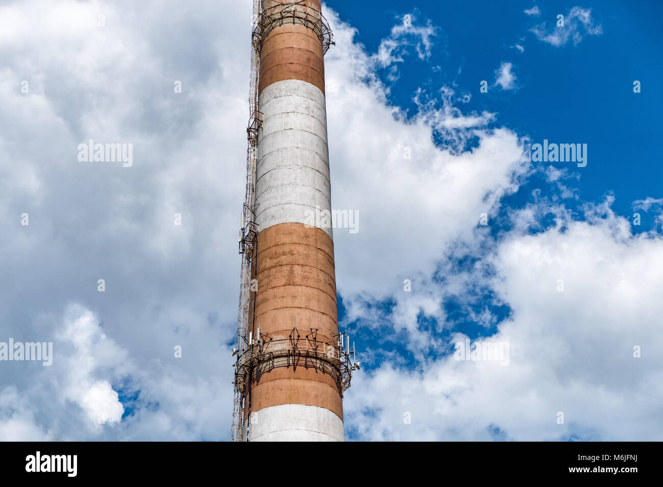Brick chimney of a factory boiler room. Brick chimney with red and ...