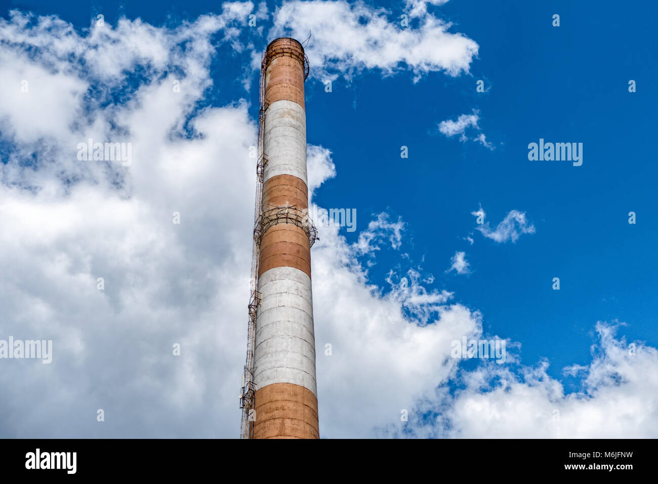 Brick chimney of a factory boiler room. Brick chimney with red and ...