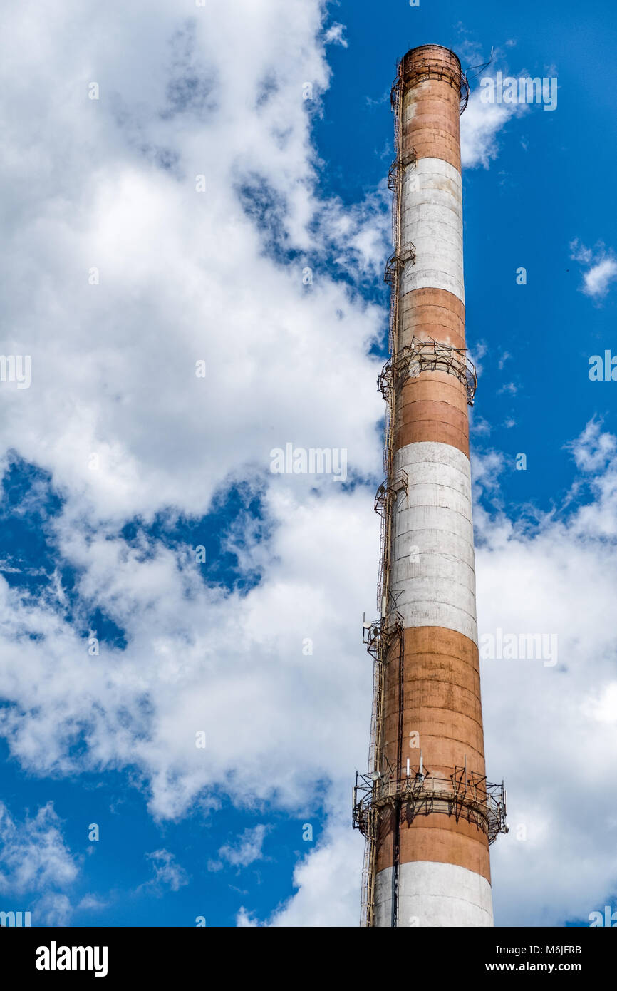 Brick chimney of a factory boiler room. Brick chimney with red and ...