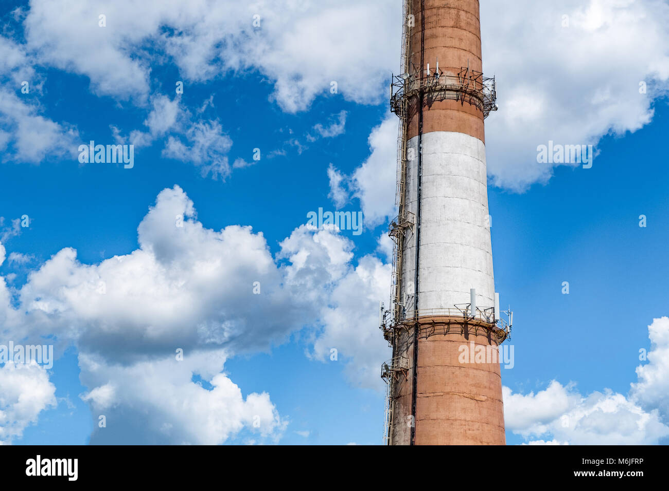 Brick chimney of a factory boiler room. Brick chimney with red and ...