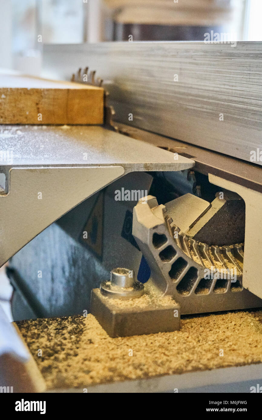Close-up view of oak wood plank on table saw, highlighting the texture ...